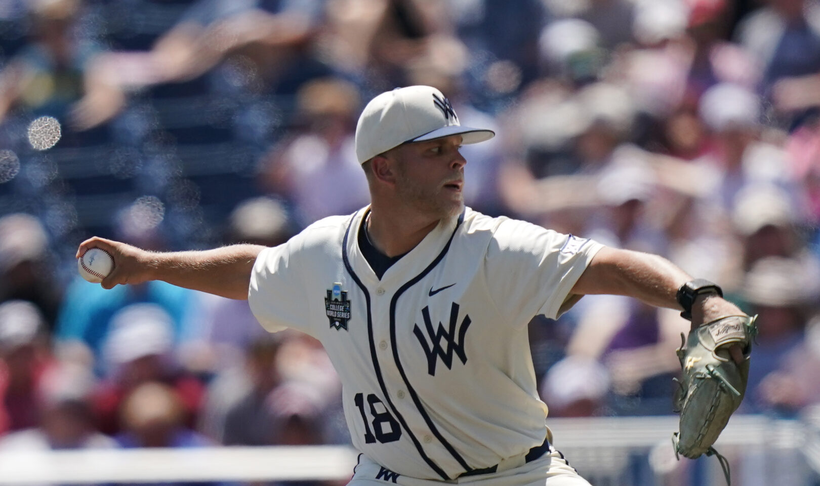 Tyrus Hall drives in four, WVU outlasts Troy, 7-5, in College World ...